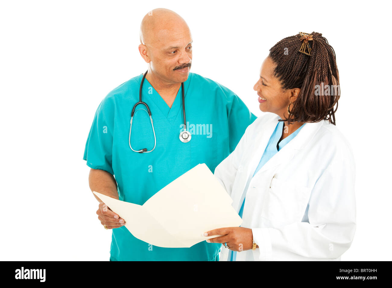 Two attractive, African American doctors discussing a patient's medical ...