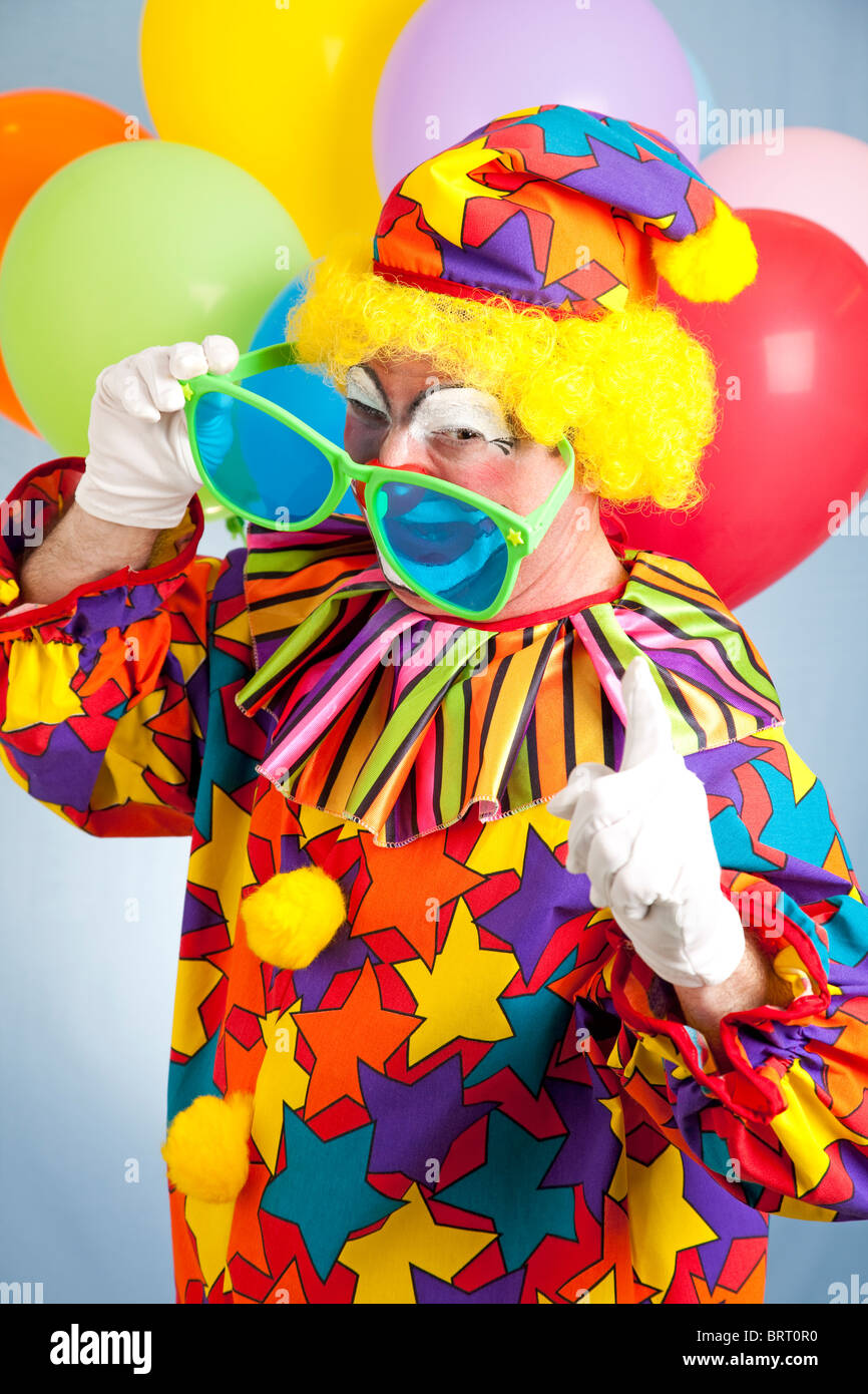 Funny hip hop clown with oversized shades shaking his finger Stock ...