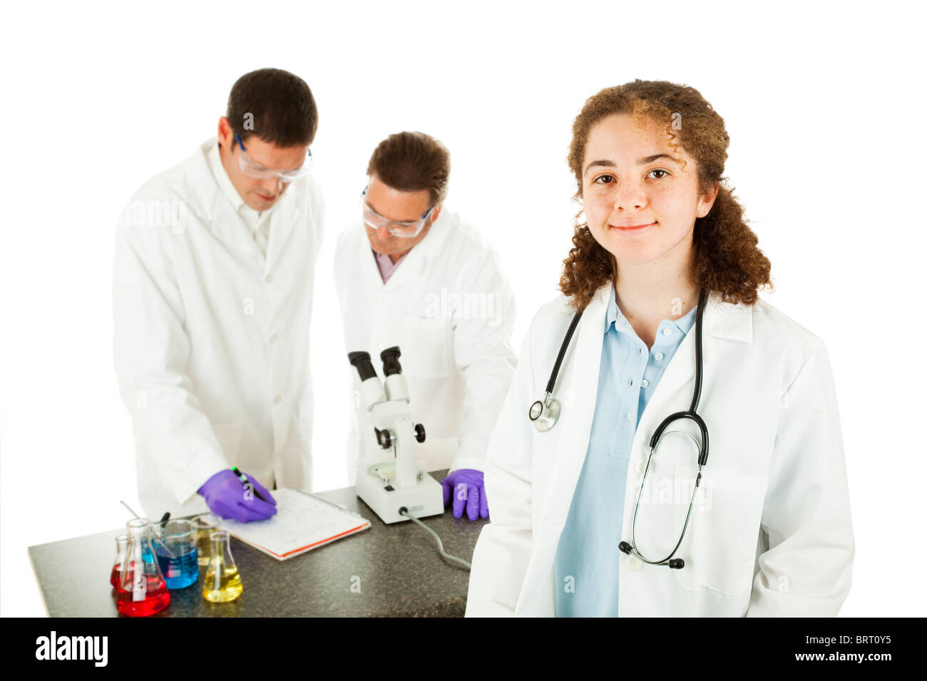 Young female medical student in the lab with scientists working in the ...