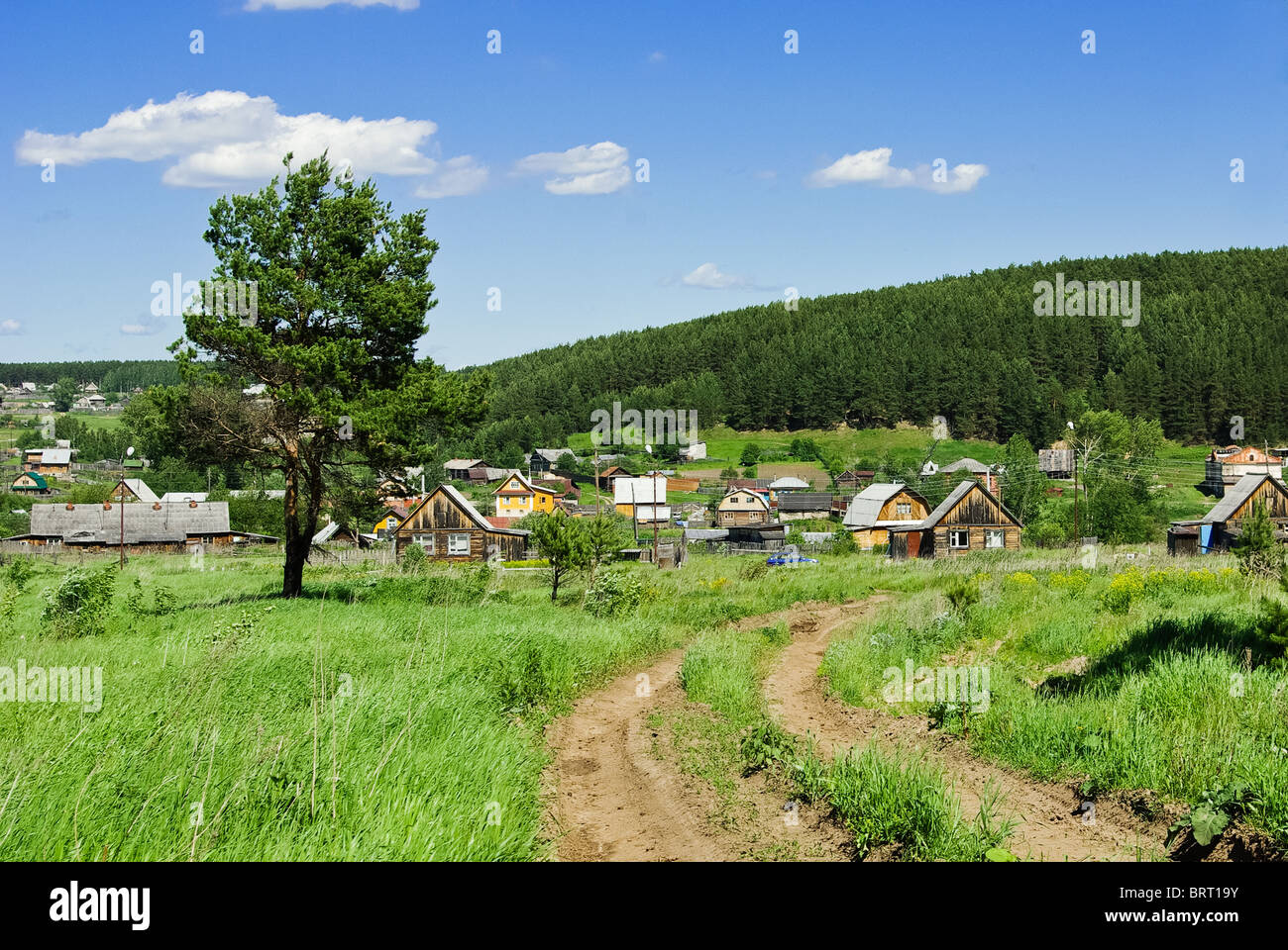 Summer landscape with a country road going to the Russian village Stock ...