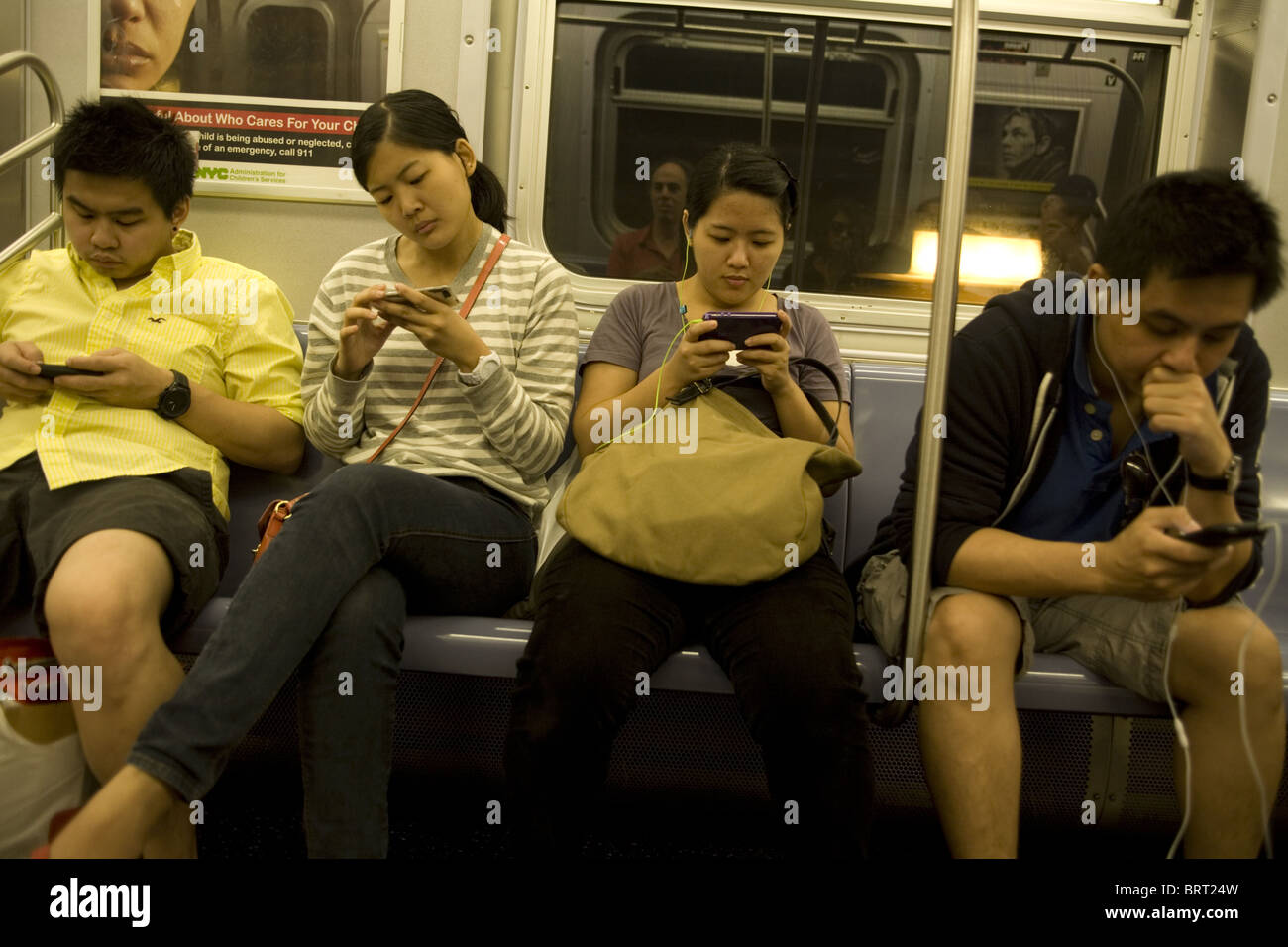 College age friends ensconced in various digital devices ride the ...