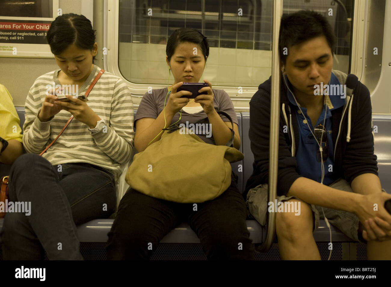 College age friends ensconced in various digital devices ride the ...