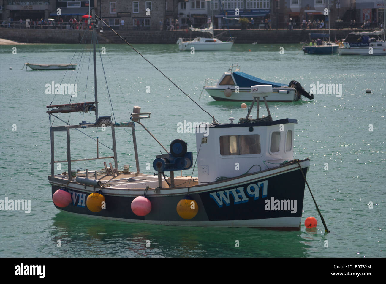 Small fishing boat in UK coastal village Stock Photo - Alamy