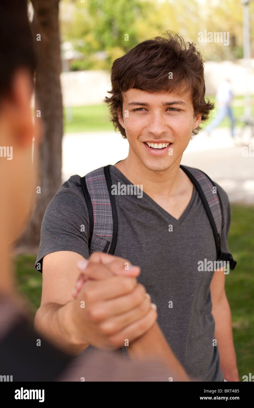 Friendship college handshake hi-res stock photography and images - Alamy