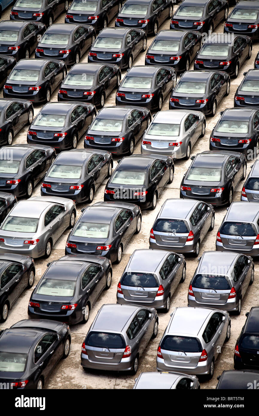 Cars parked and stored on Lisbon harbour quayside for onward shipping ...
