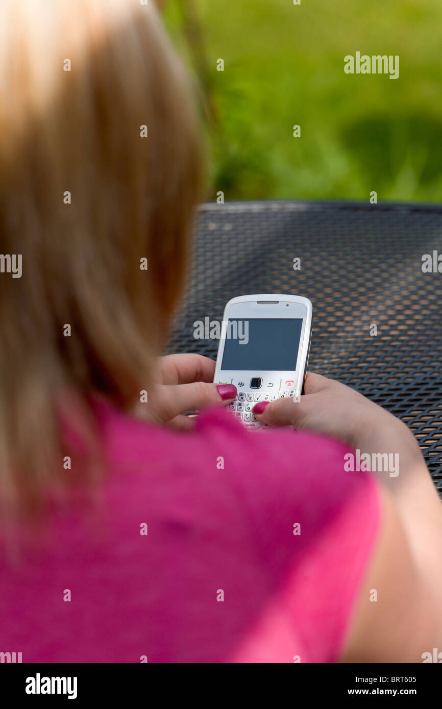 Teenager texting back view hi-res stock photography and images - Alamy