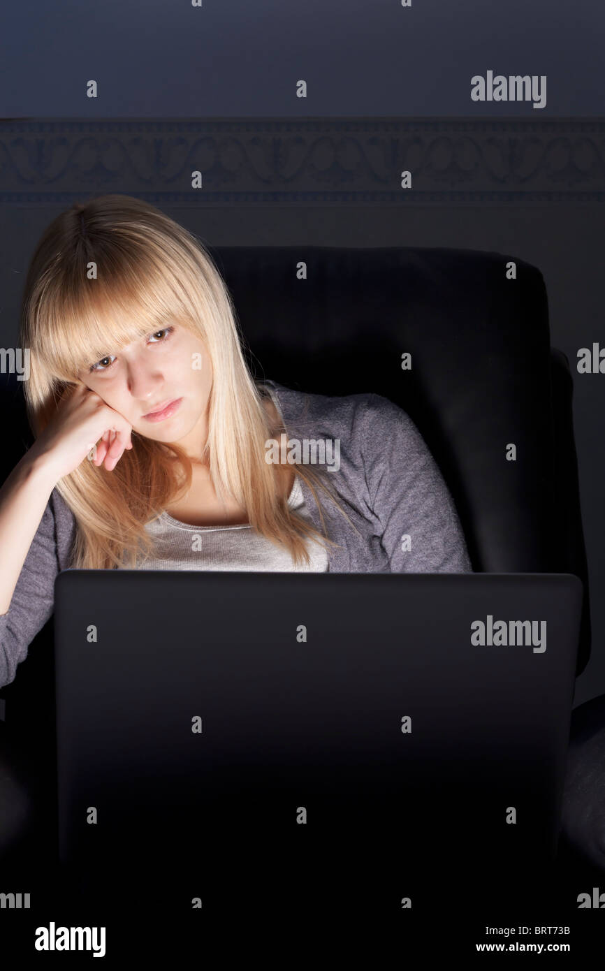 Bored Woman with Laptop Stock Photo - Alamy