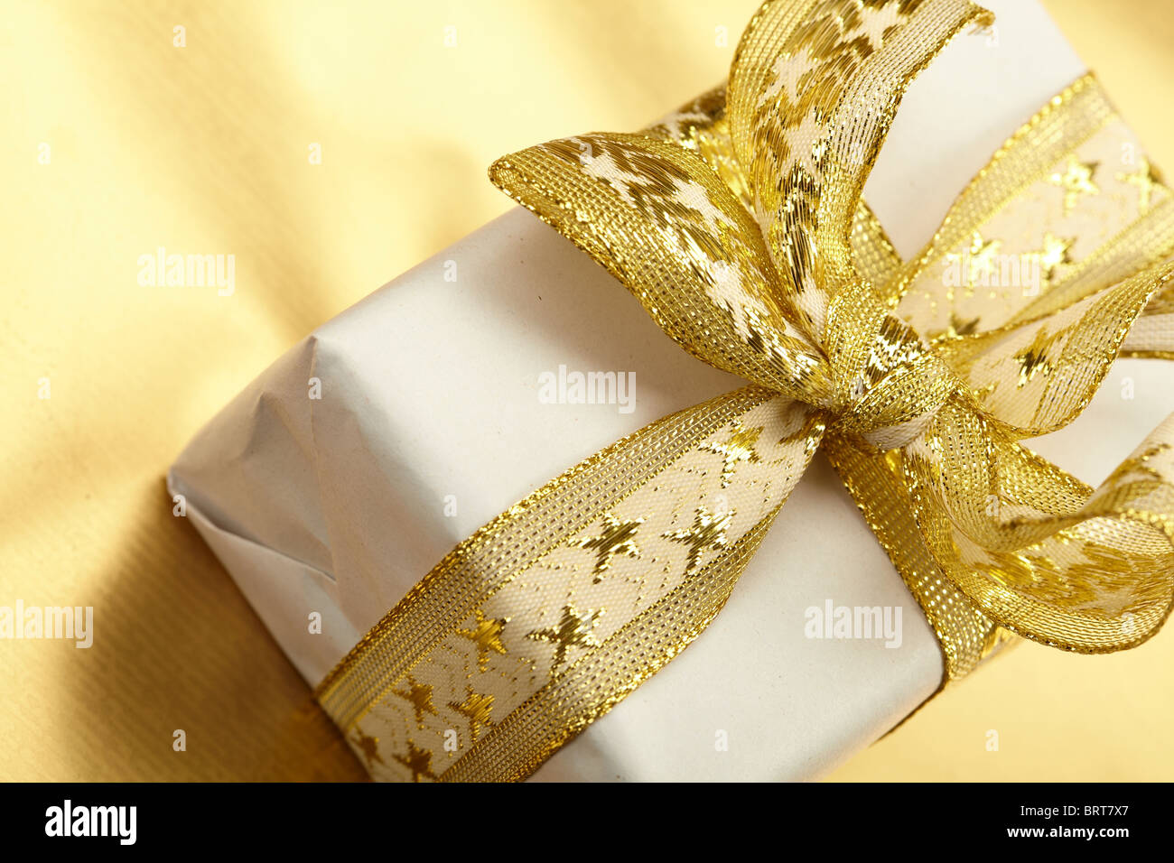 gift box with gold ribbon Stock Photo - Alamy