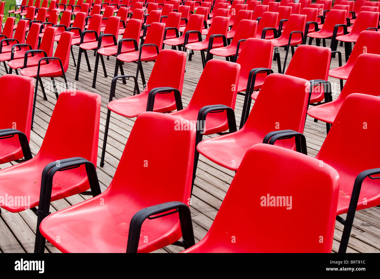 Many plastic chairs hi-res stock photography and images - Alamy