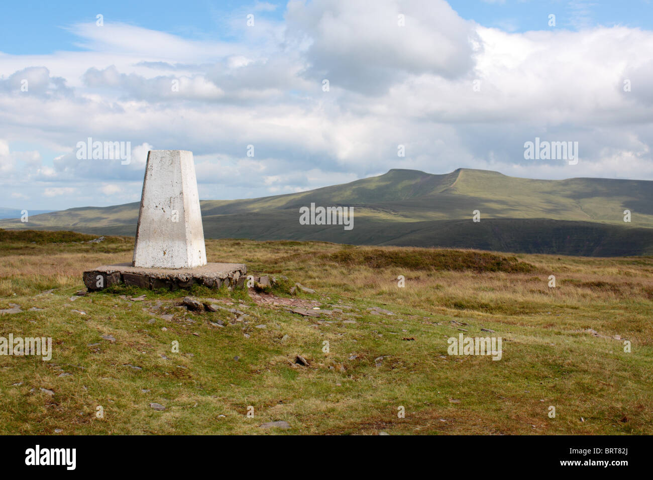 The summit trig pillar on Fan Frynych, with Pen y Fan and Corn Du ...