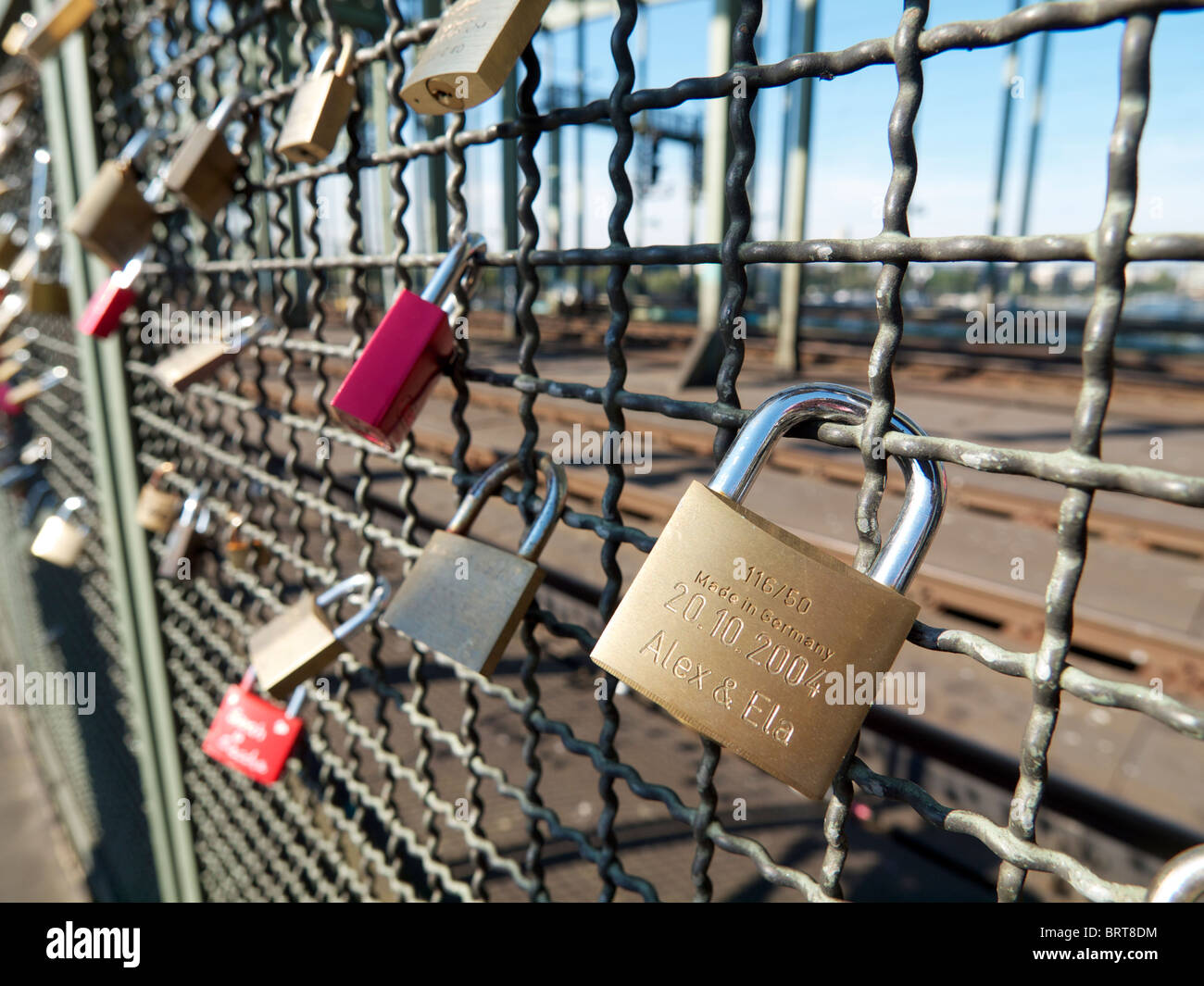 Many padlocks attached to the Hohenzollernbrucke railway bridge in ...
