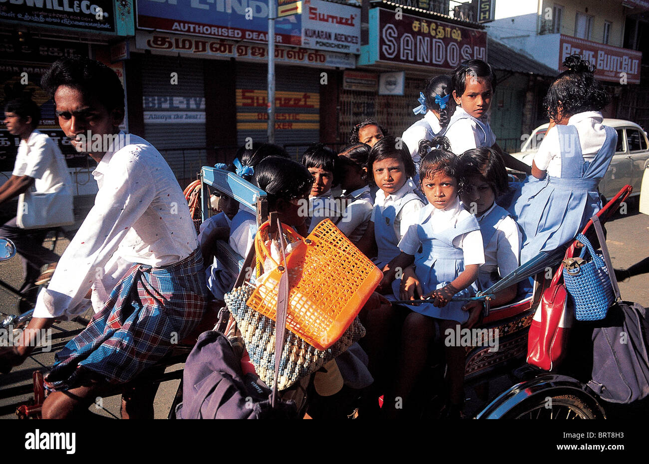 School children ride in a rickshaw in Jaunpur India Stock Photo - Alamy
