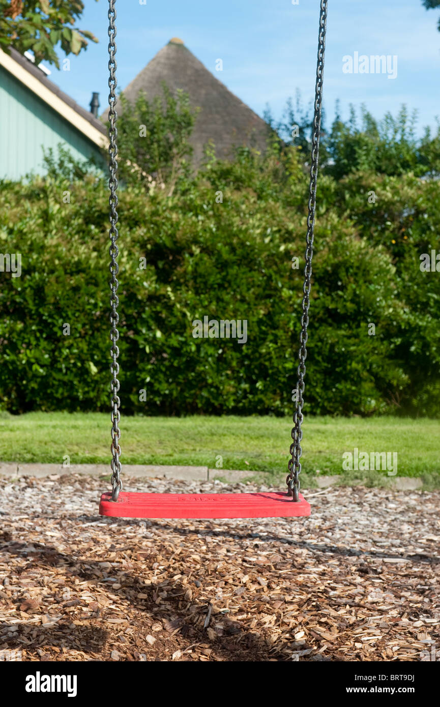 Red swing hi-res stock photography and images - Alamy