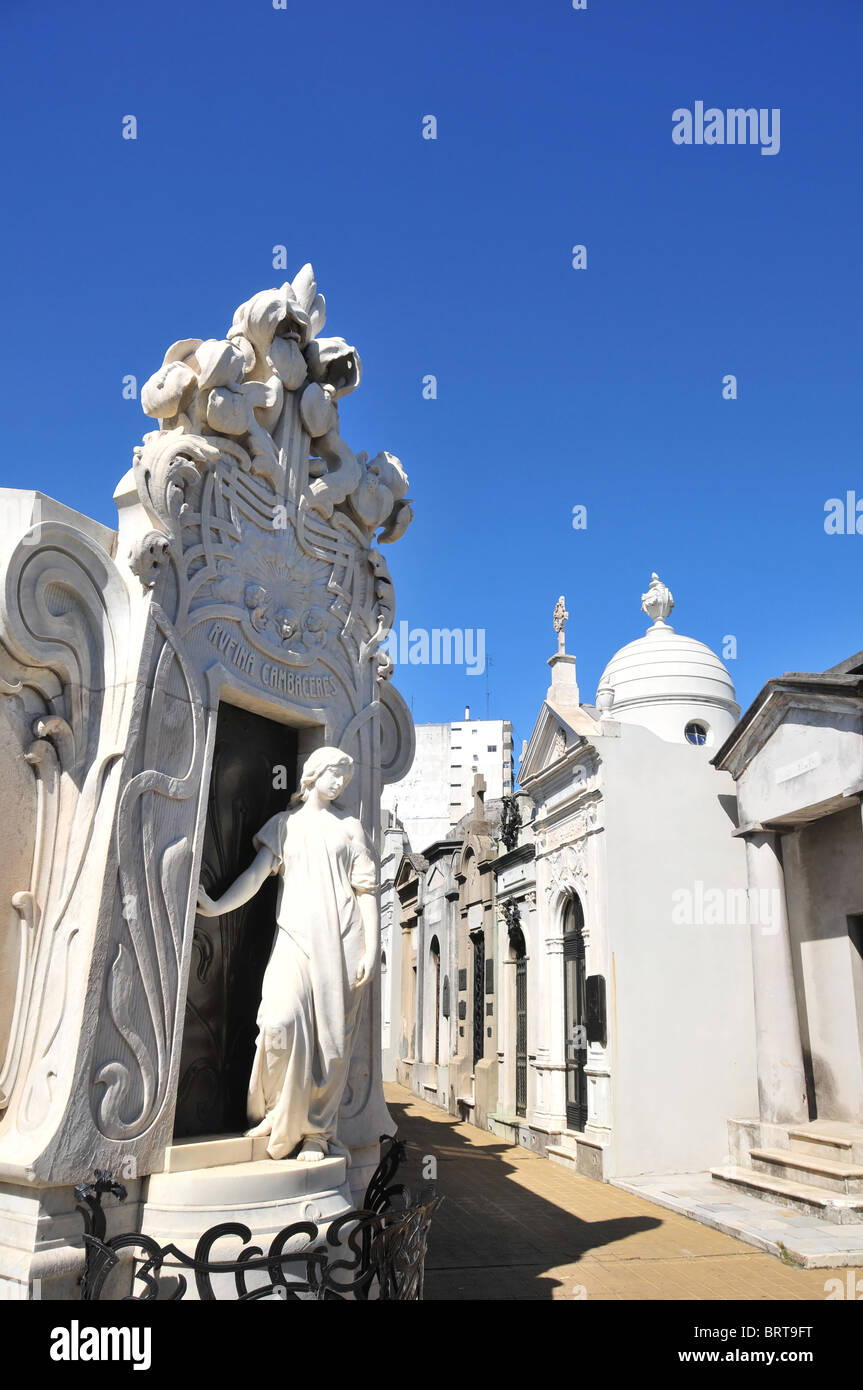 Sad, forlorn female marble statue standing at the doorway of a ...
