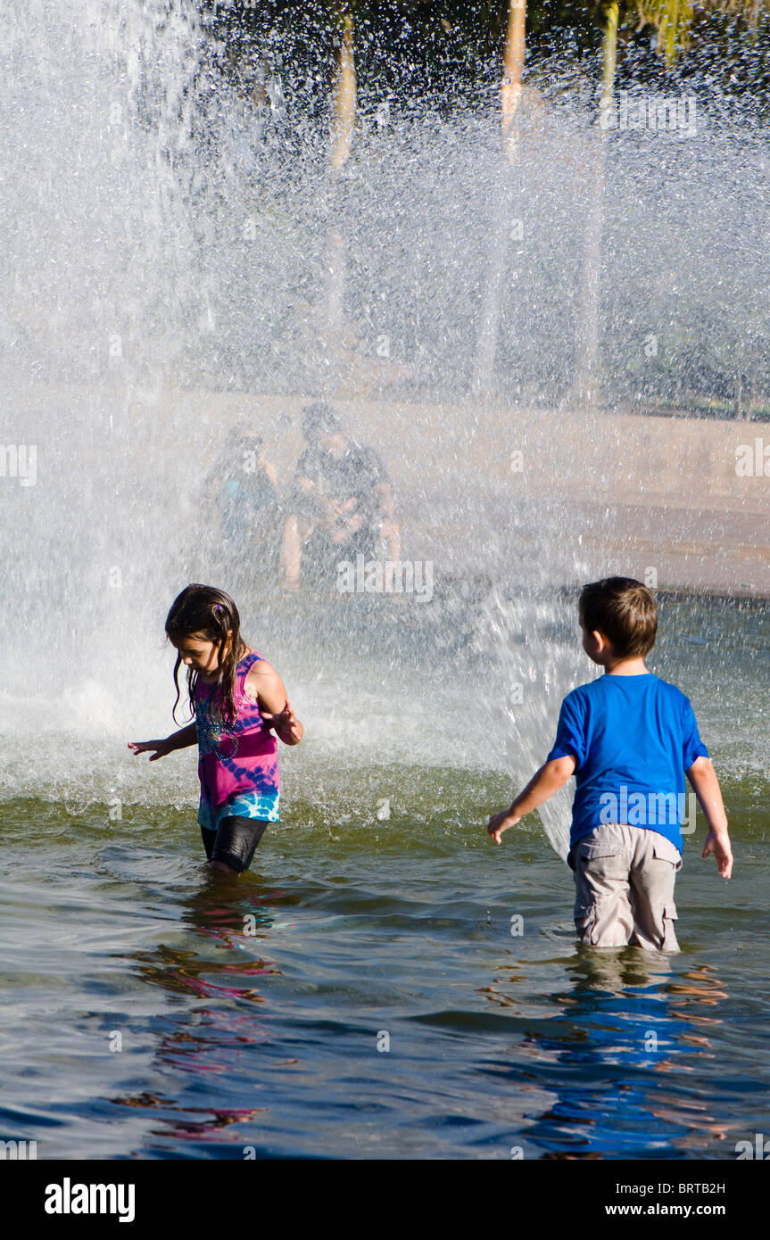 Kids playing in fountain Stock Photo - Alamy