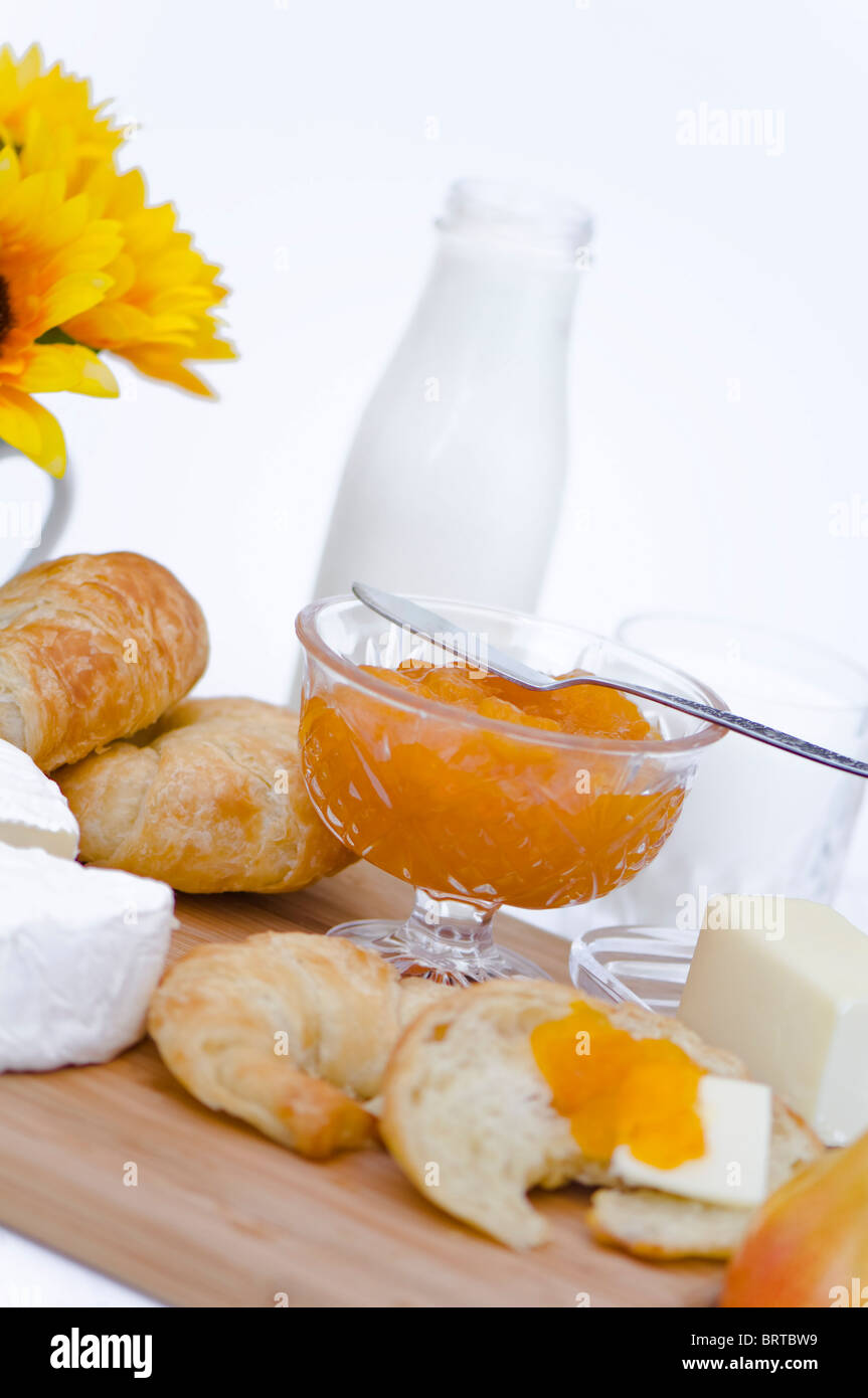 Breakfast with croissant, Camembert cheese, milk, and apricot jam Stock ...