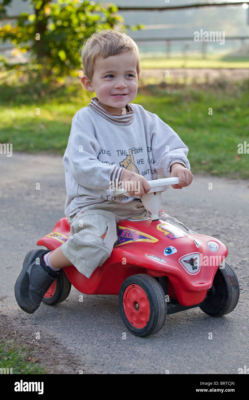 portrait of a little boy on his bobby car Stock Photo - Alamy