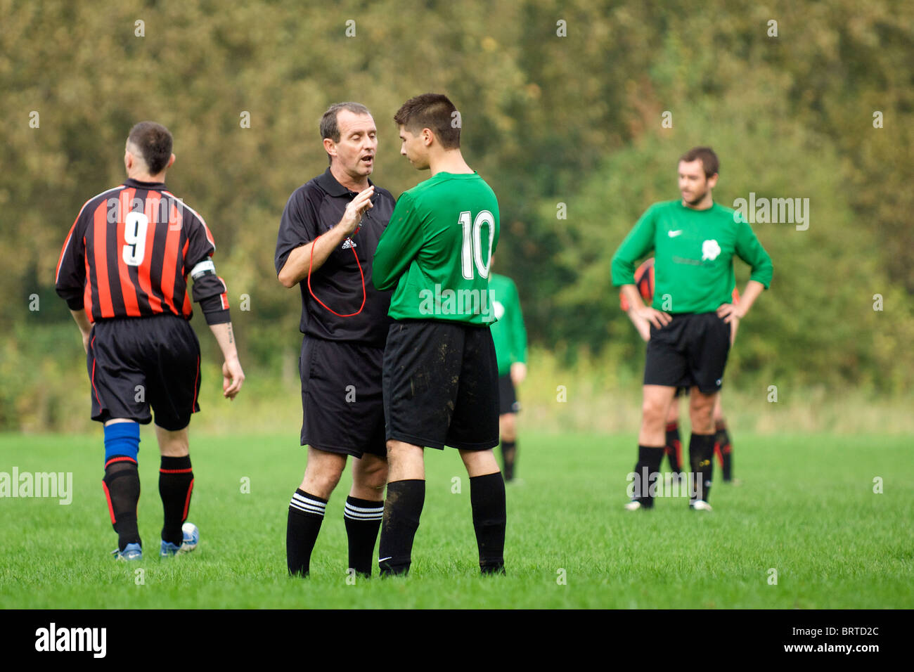 referee reprimands a player in a football match Stock Photo - Alamy