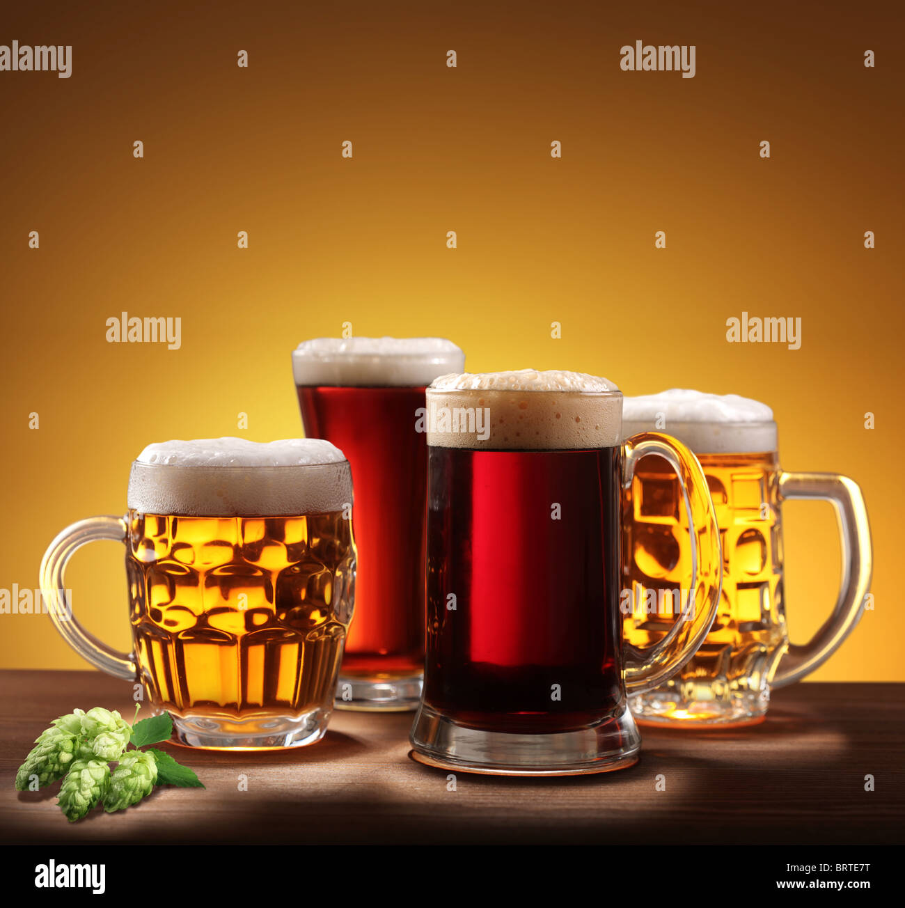 Still-life with beer glasses. On a yellow background Stock Photo - Alamy