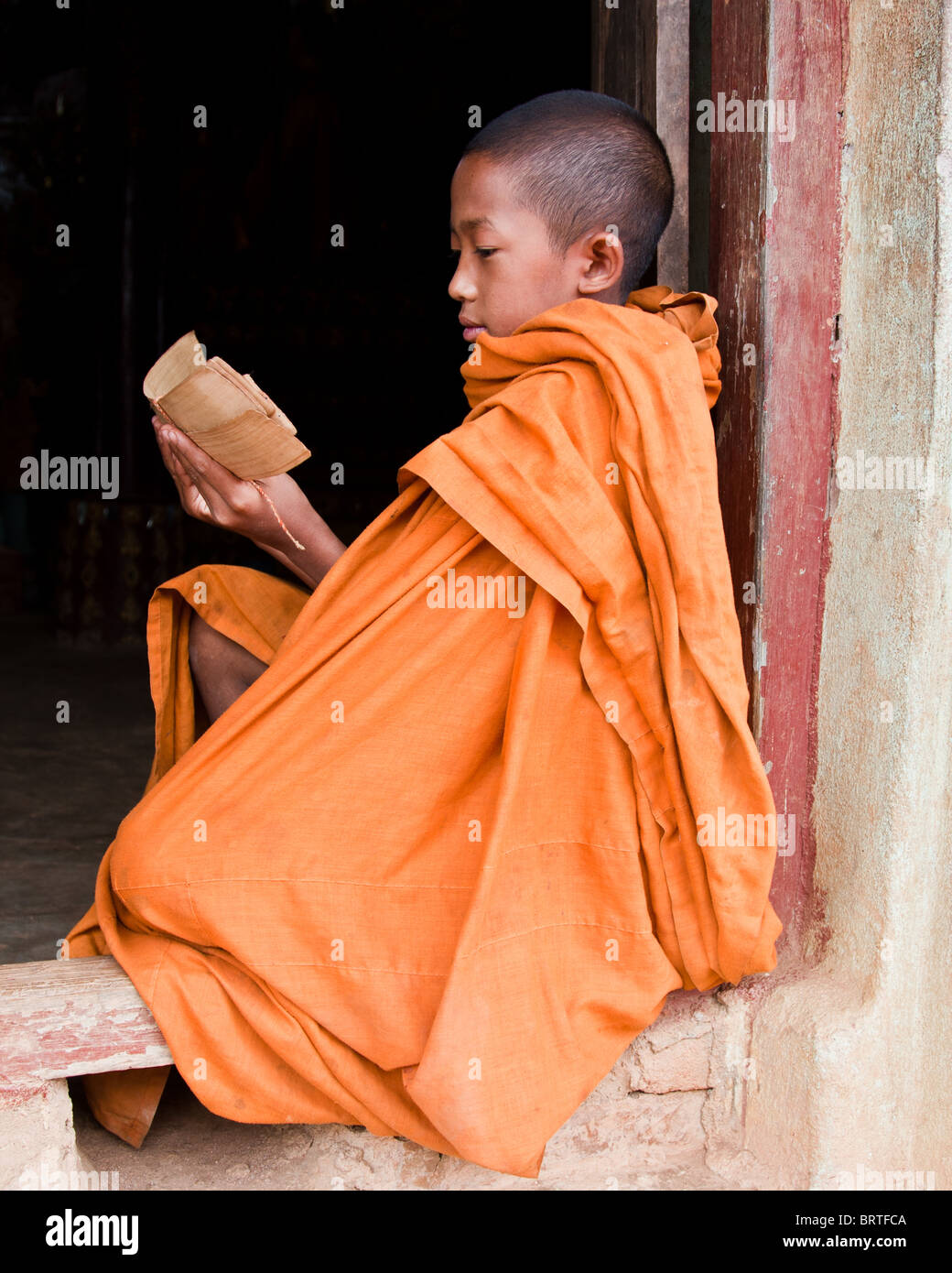Novice monk by door of temple hi-res stock photography and images - Alamy