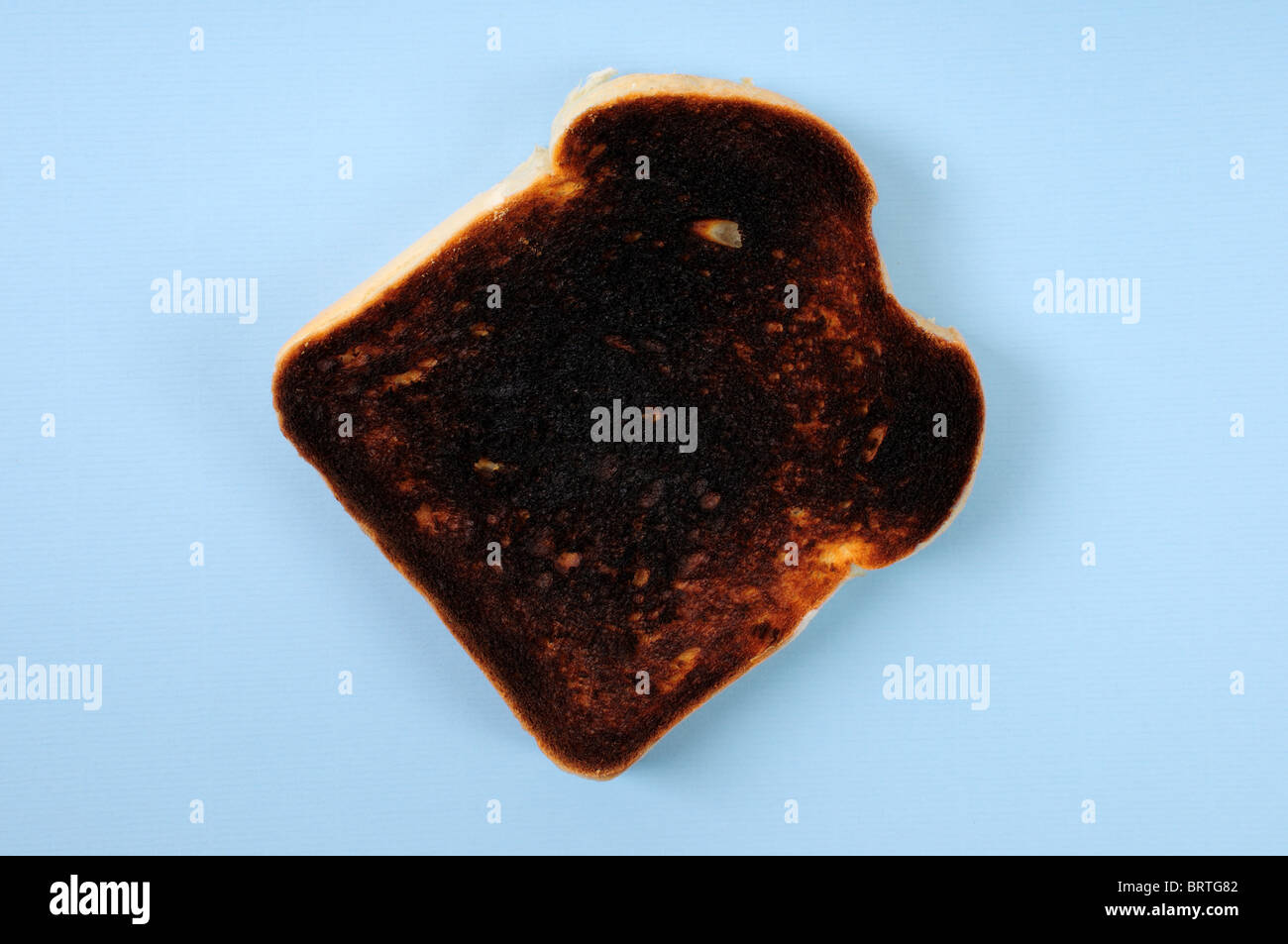 Slice of Burnt Toast Stock Photo - Alamy