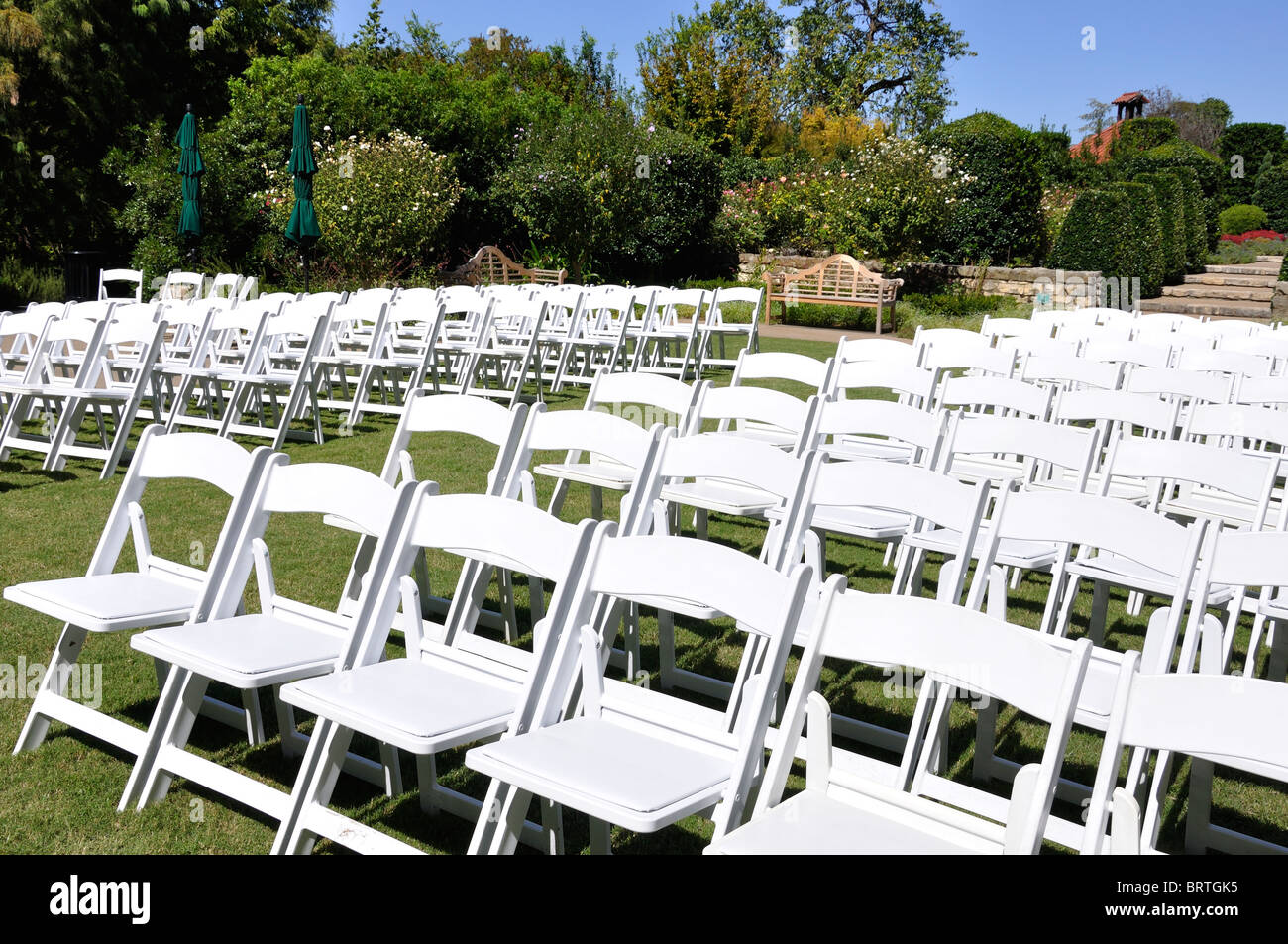Rows of white chairs Stock Photo - Alamy