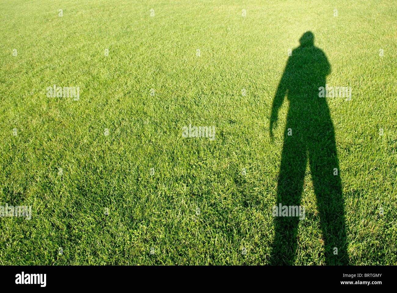 PHOTOGRAPHER SHADOW ON LAWN Stock Photo - Alamy