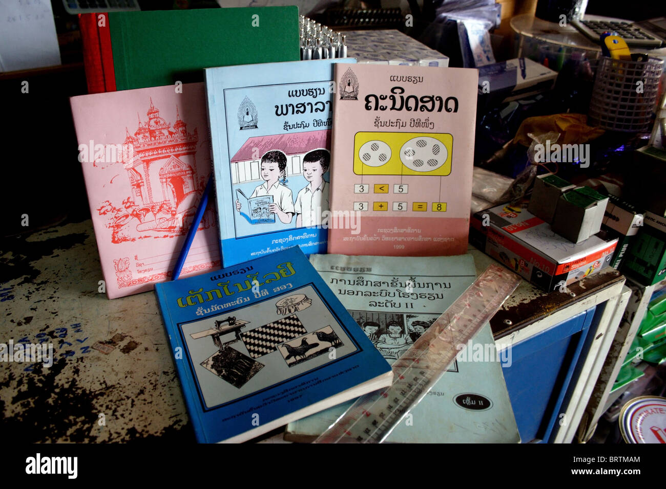 The official Lao government primary school textbooks and workbooks rest ...