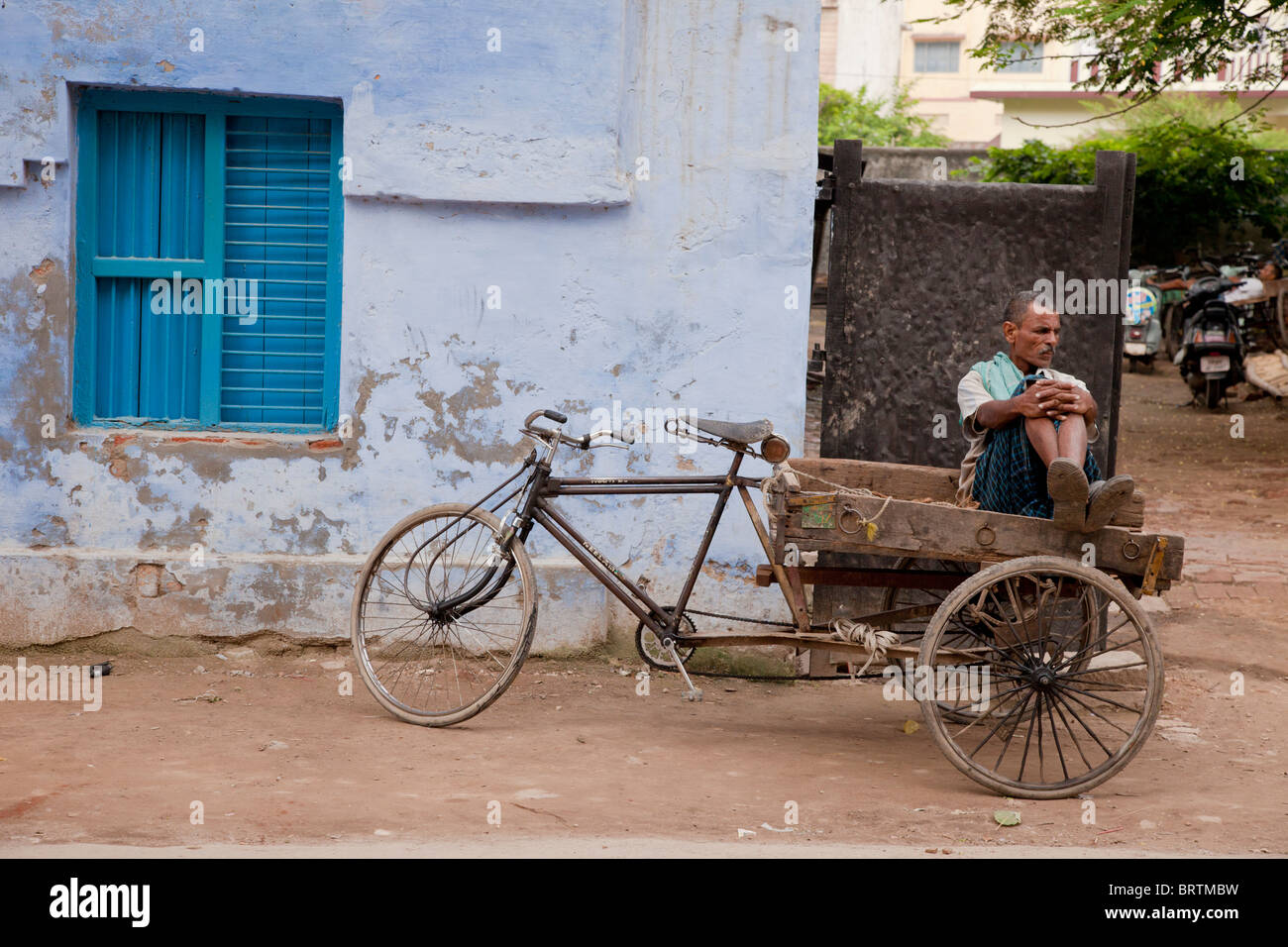 Indian man on rickshaw hi-res stock photography and images - Alamy