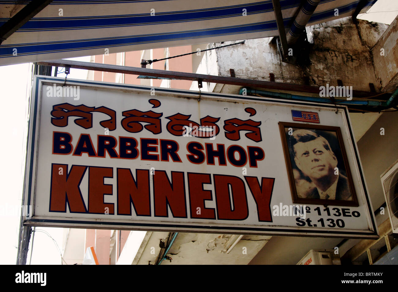 The Kennedy barbershop is located on Street 130 and is visited by men ...