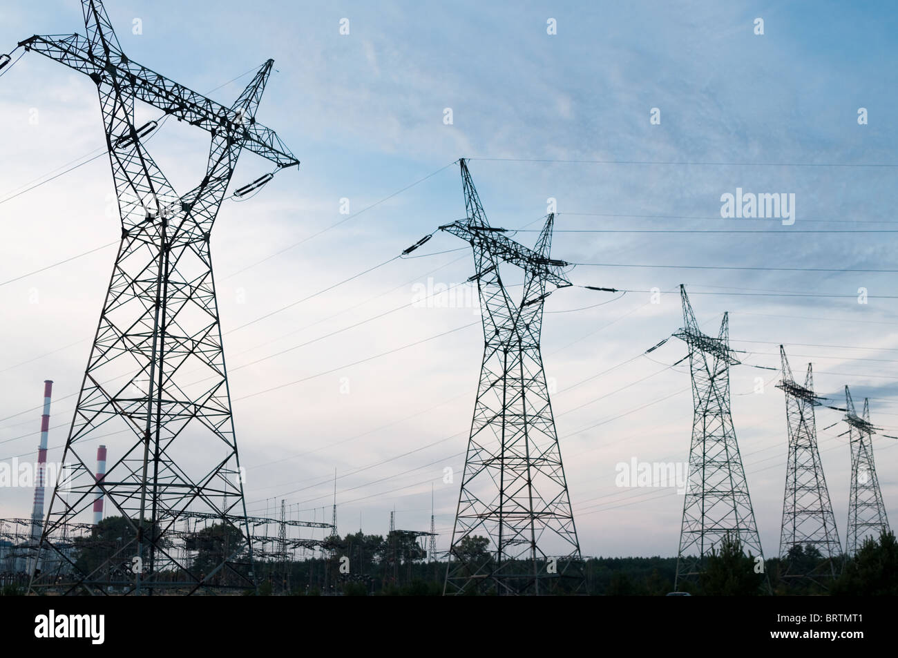 Transmission power line in sunset Stock Photo - Alamy