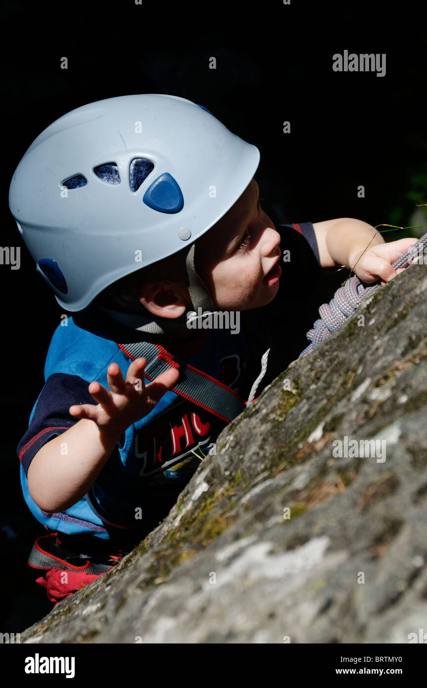 A young boy rock climbing at Church Crag, near to Arolla in the Swiss ...