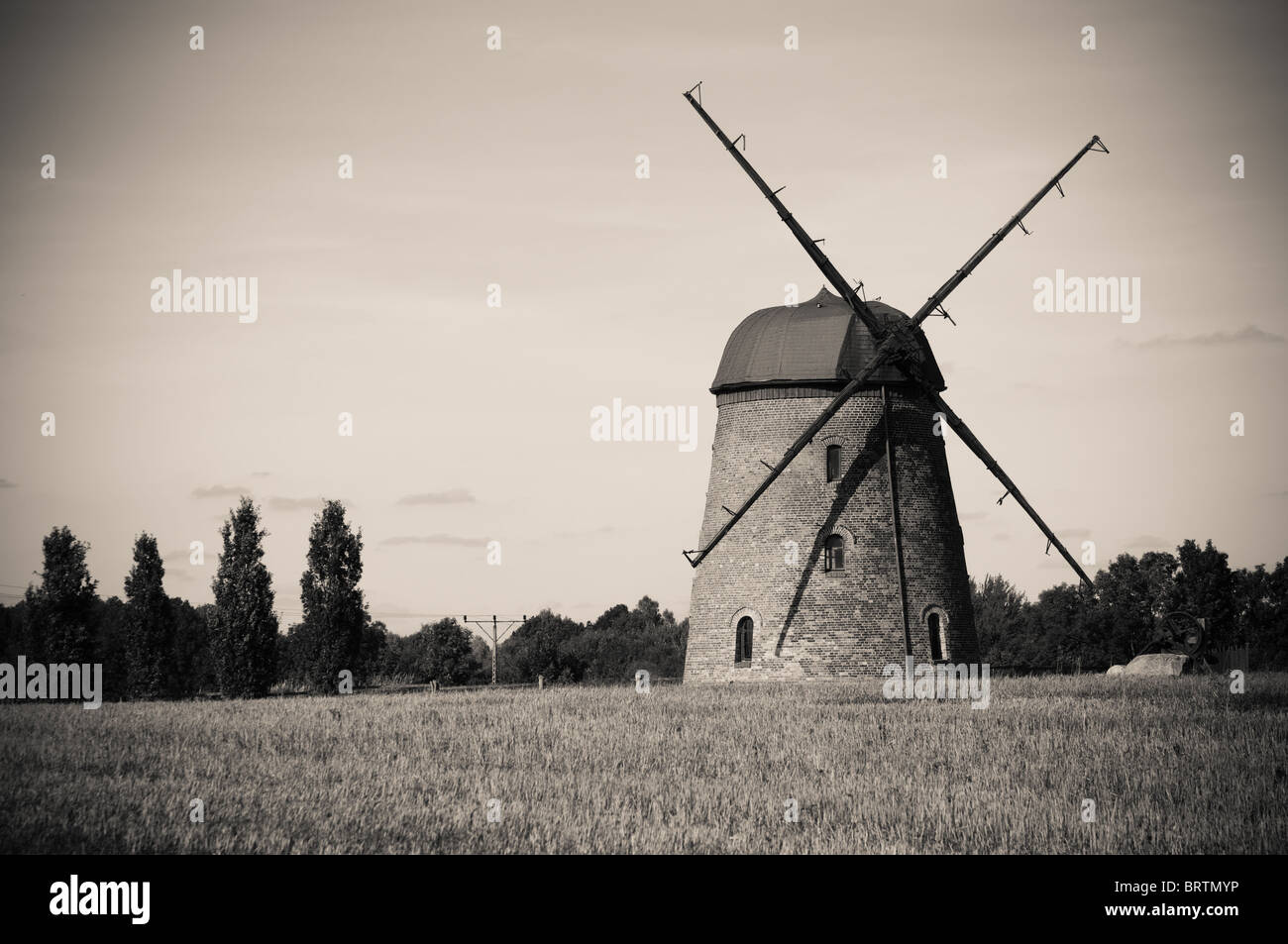 windmill on farm field in summertime Stock Photo - Alamy