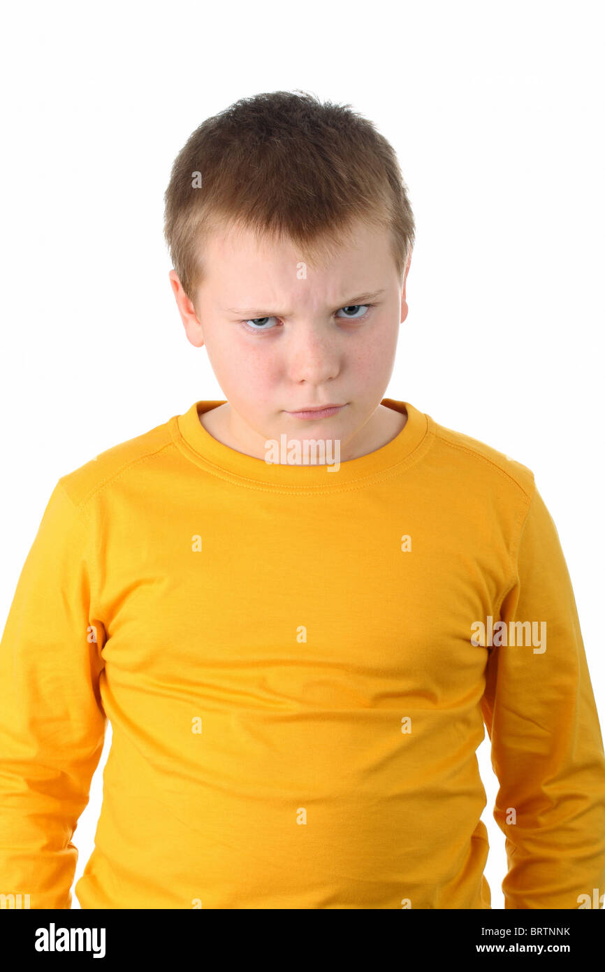 Angry 10 year old boy isolated on white Stock Photo - Alamy
