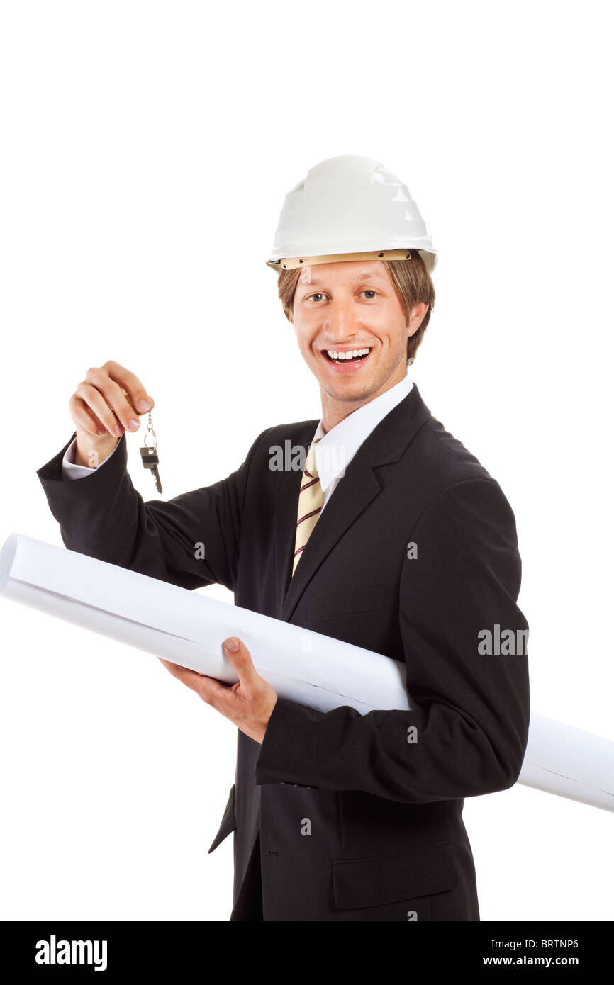 An architect wearing a hard hat and a suit looking at a blueprint Stock ...