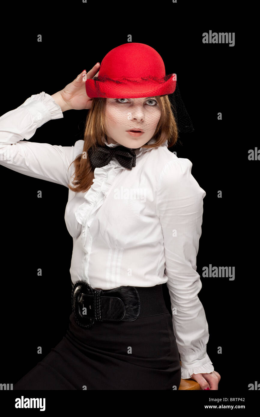 Portrait of a pretty young woman with red bonnet Stock Photo - Alamy