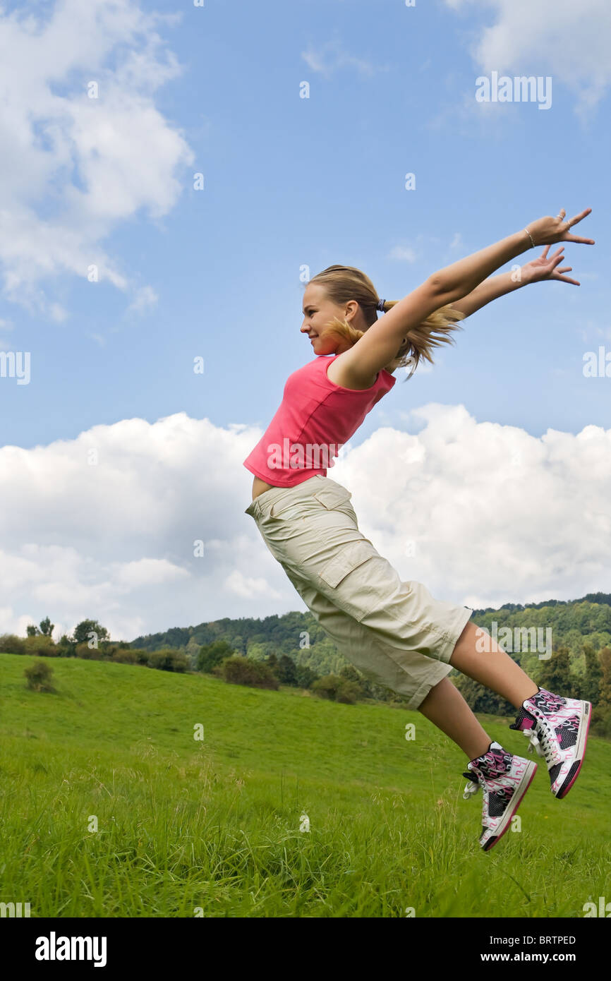 girl jump on meadow Stock Photo - Alamy