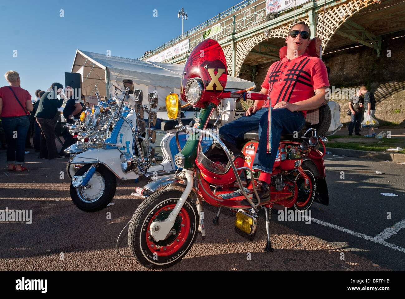 Man sitting on cut down Lambretta dressed as a mod Stock Photo - Alamy