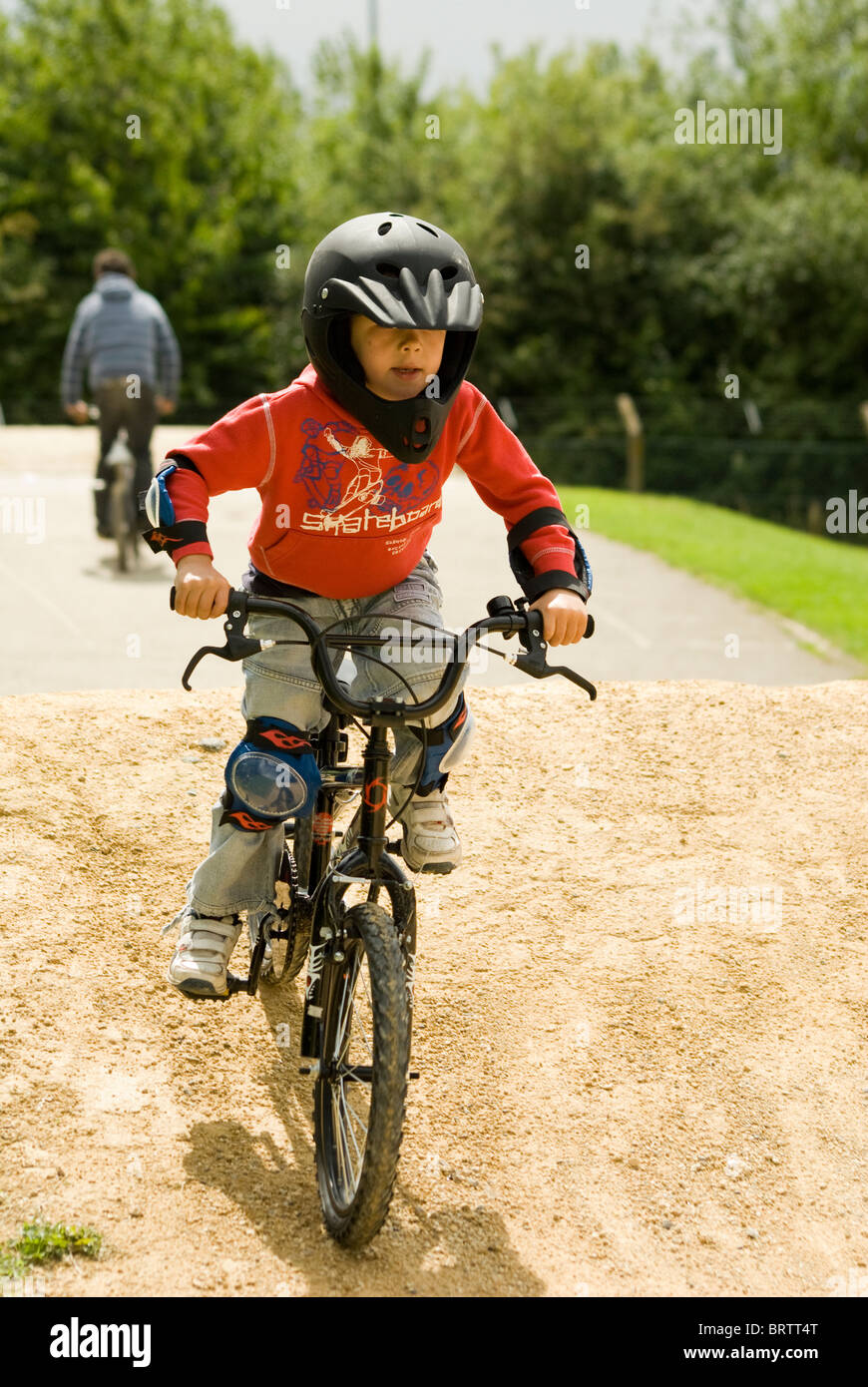Child riding a BMX on a track Stock Photo - Alamy