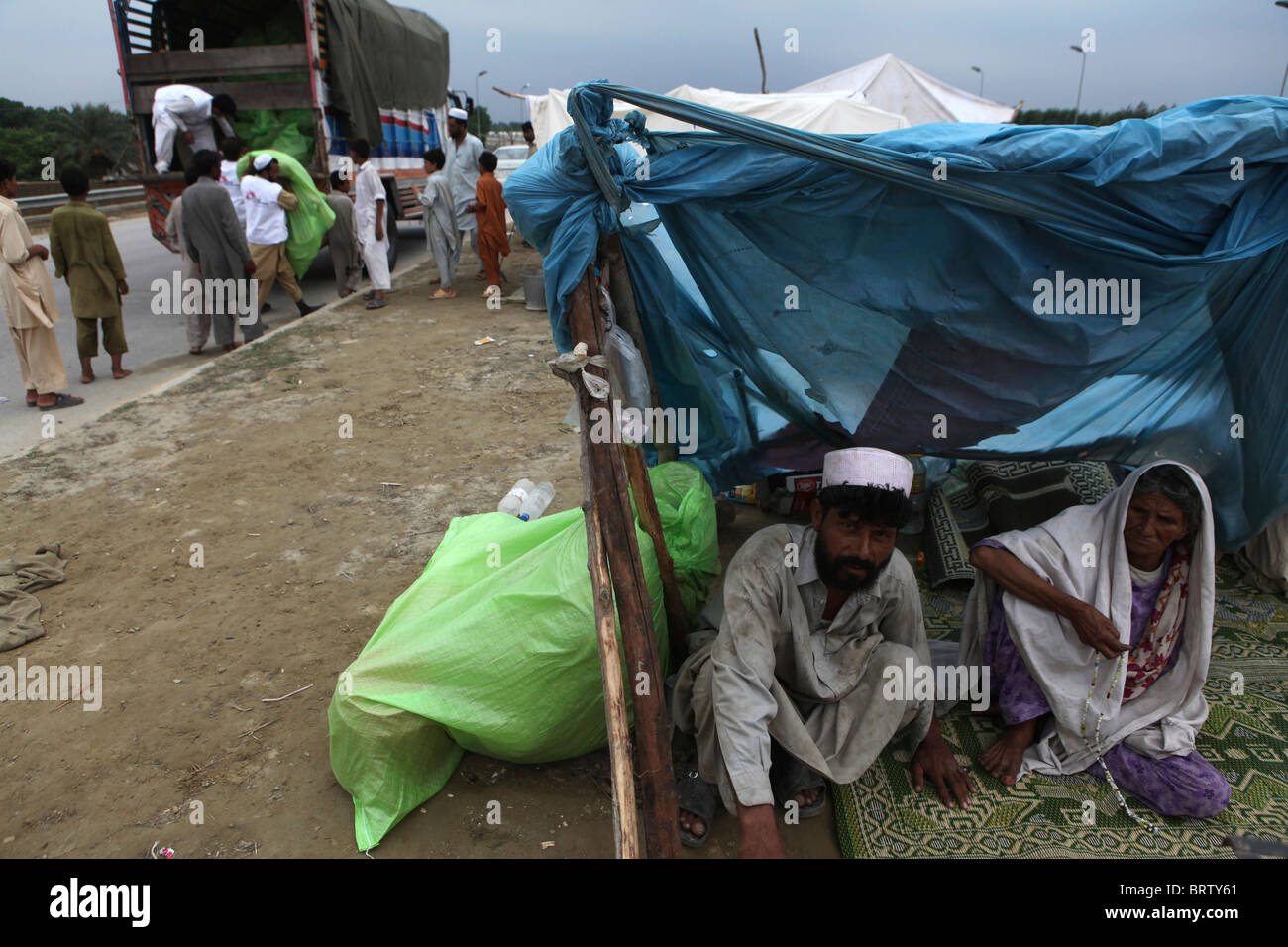 charity distribution to flood victims in pakistan Stock Photo - Alamy