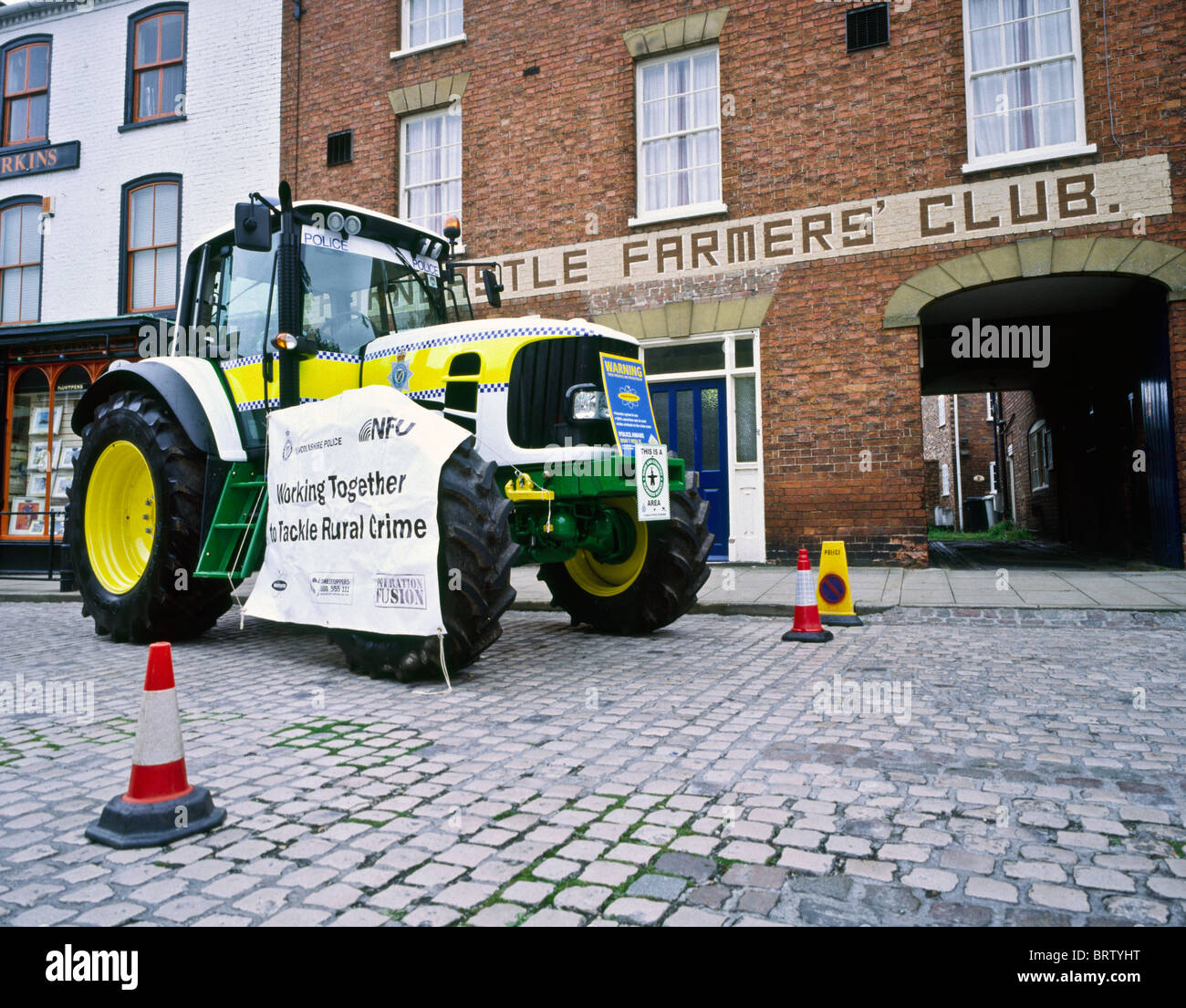A john deere tractor in police livery used for farm awareness Stock ...