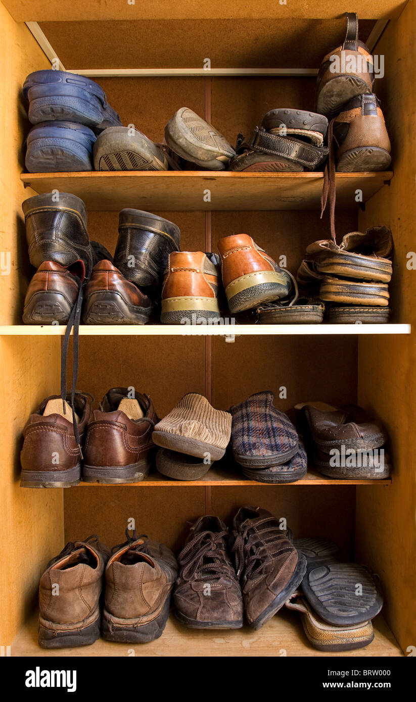 An old wooden shoes box with a lot of different footwear inside Stock ...