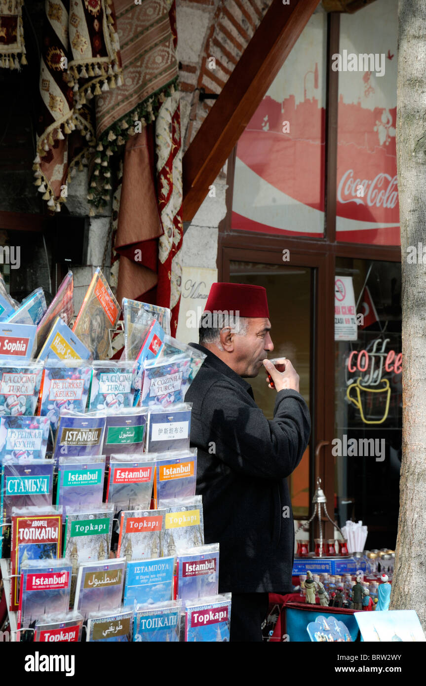 stall owner drinking turkish coffee istanbul turkey market stall bazaar ...