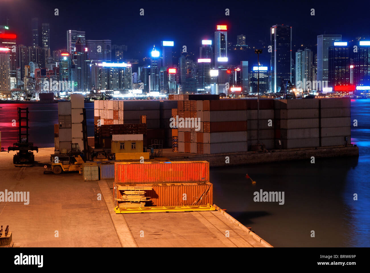 Small freight terminal in Hong Kong at night Stock Photo - Alamy