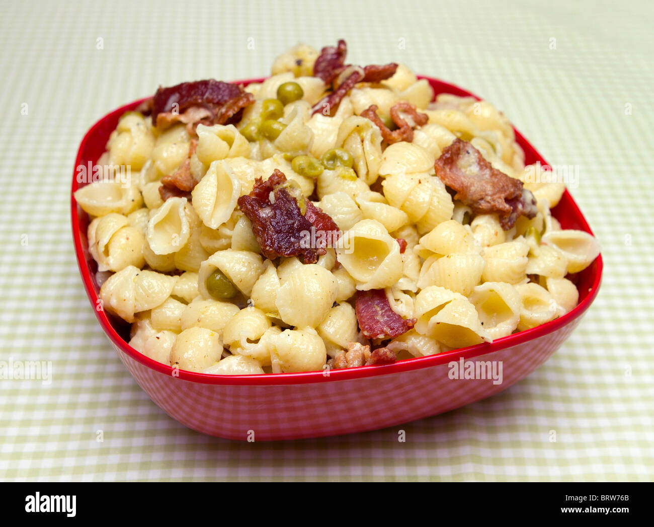 one bowl of bacon and mini shell pasta with creamy pea sauce Stock ...