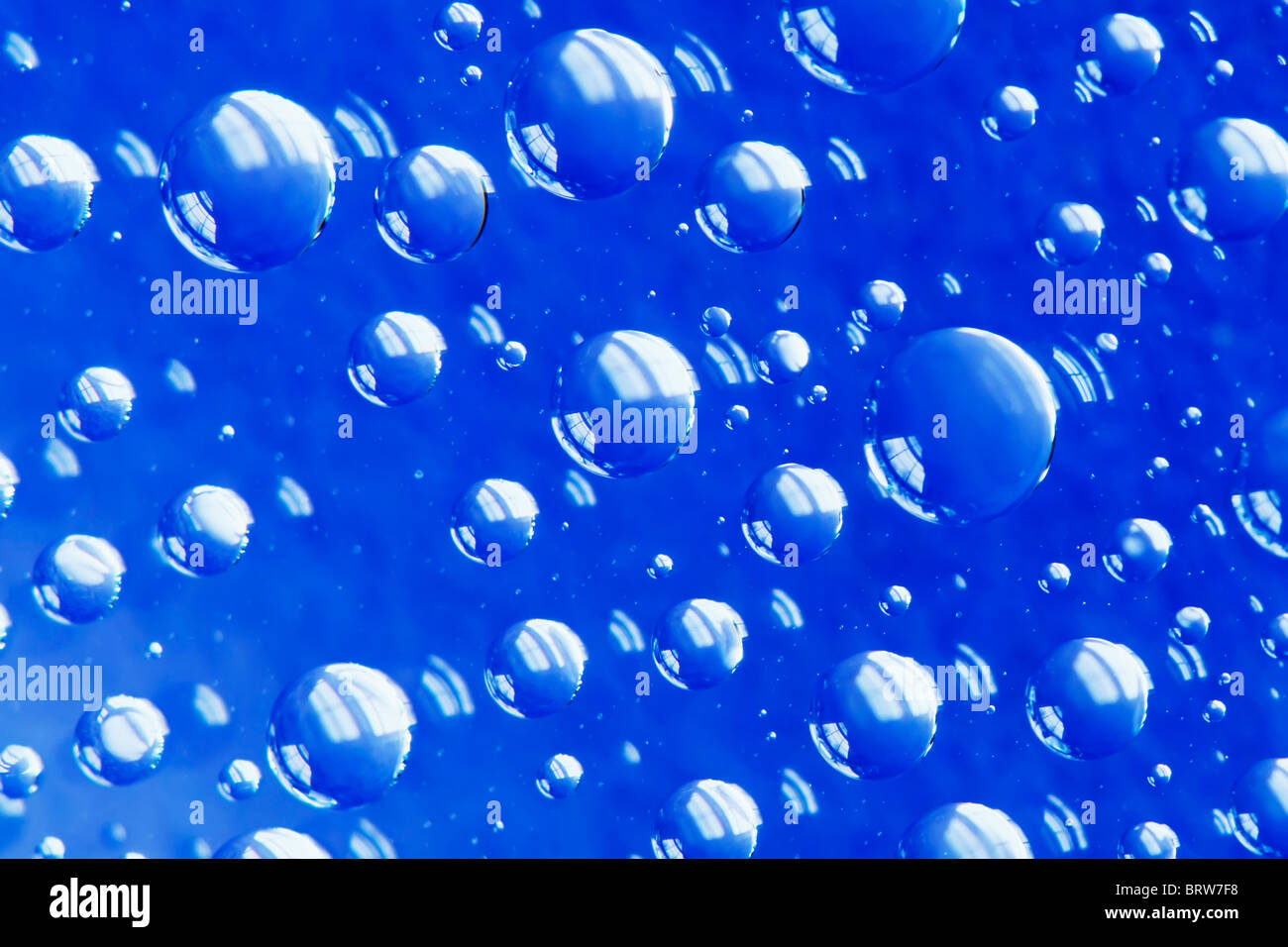 Bubbles on a blue sheet of plastic Stock Photo - Alamy