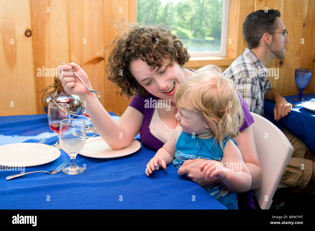 a mother and daughter diner smiling at a restaurant Stock Photo - Alamy