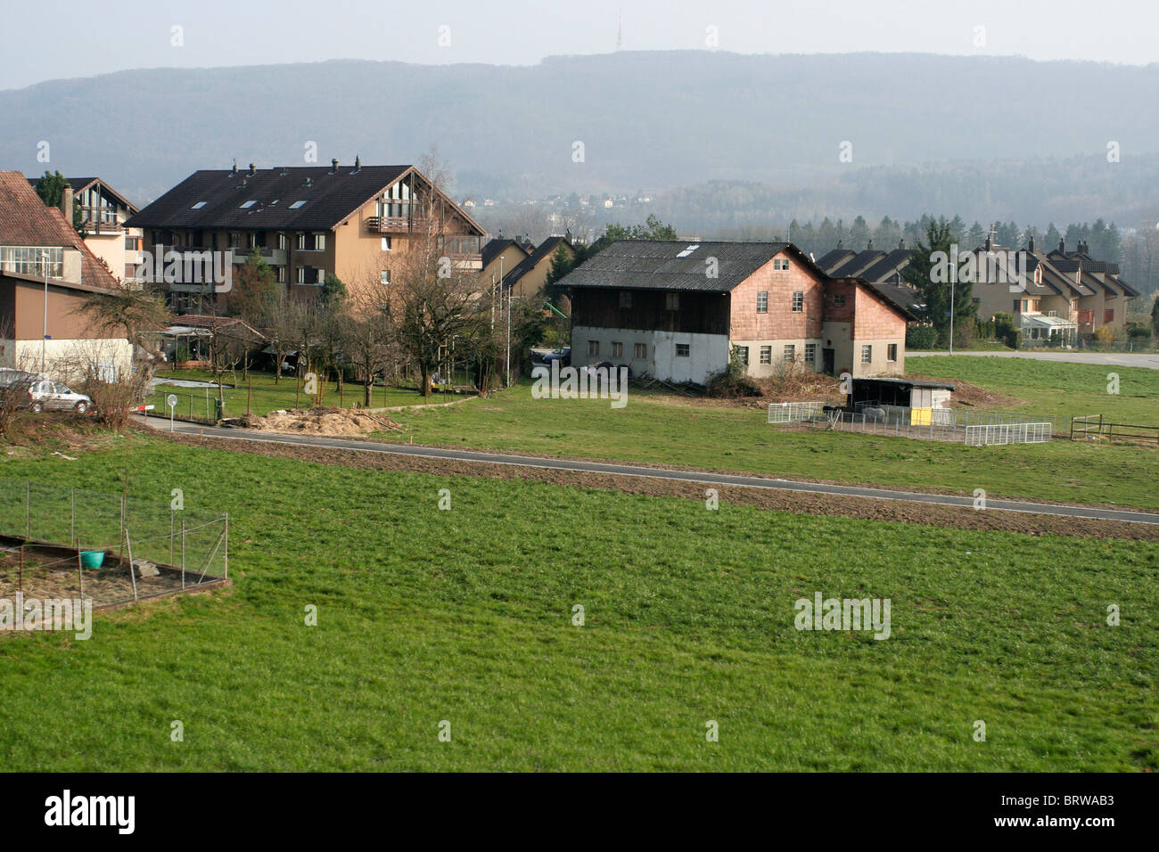 Traditional homes in Switzerland countryside Stock Photo - Alamy