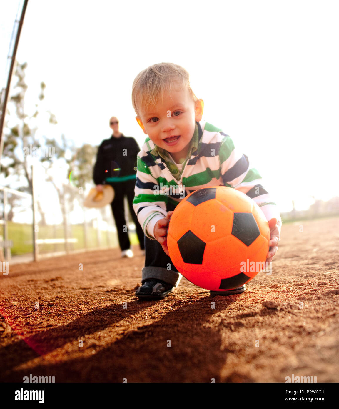 Boy in orange soccer hi-res stock photography and images - Alamy