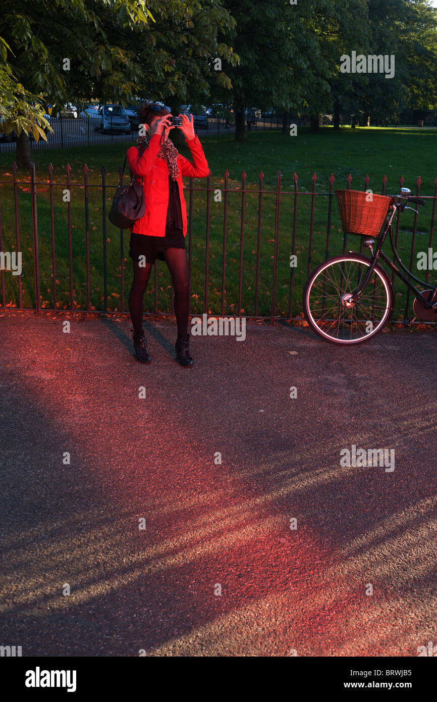 Red-tinted landscape with lady wearing red caused by the Serpentine ...